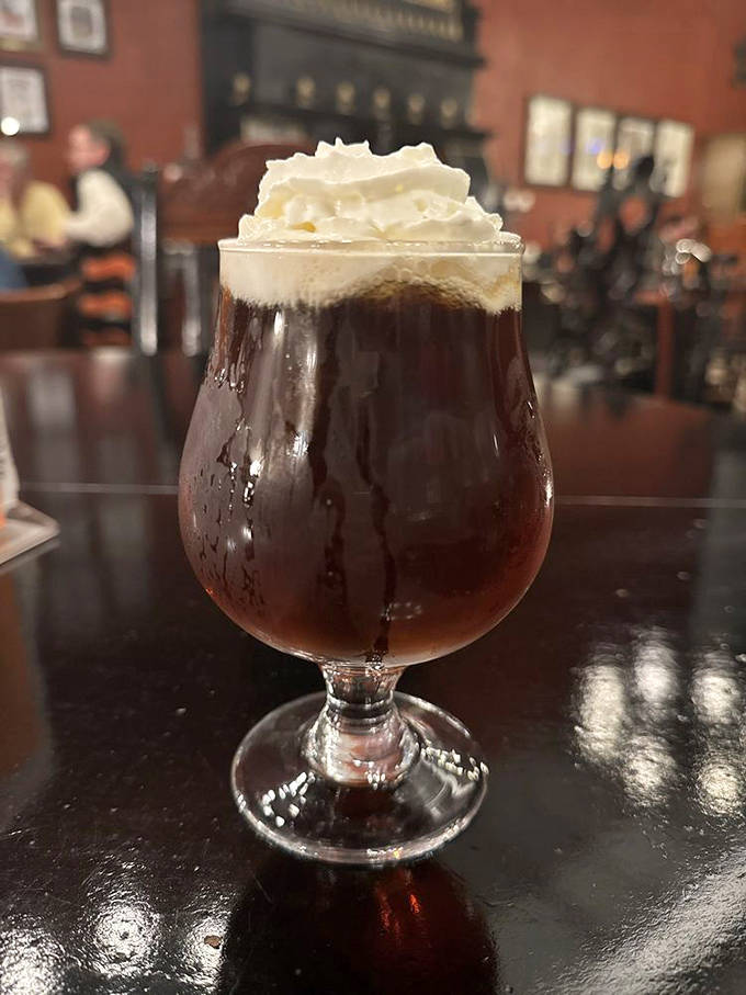 The pumpkin spice brew arrives like autumn in a glass, topped with a cloud of whipped cream that's practically begging for a selfie.