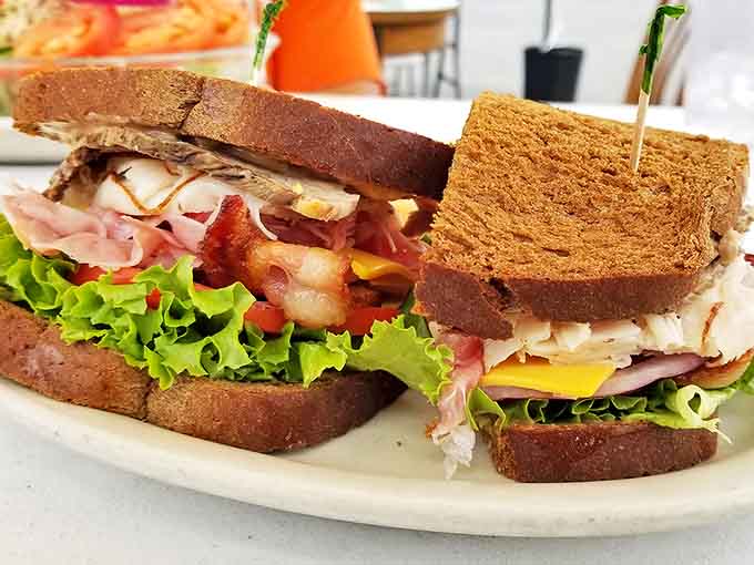 This isn't just a sandwich; it's an architectural achievement &ndash; layers of meat, cheese, and fresh veggies between substantial bread slices that demand a two-handed commitment.