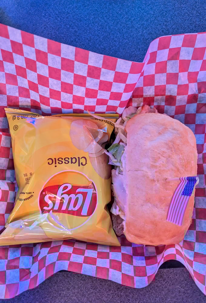 Nothing says "America" quite like a sandwich with chips tucked into red-and-white checkered paper &ndash; the edible equivalent of a Norman Rockwell painting.