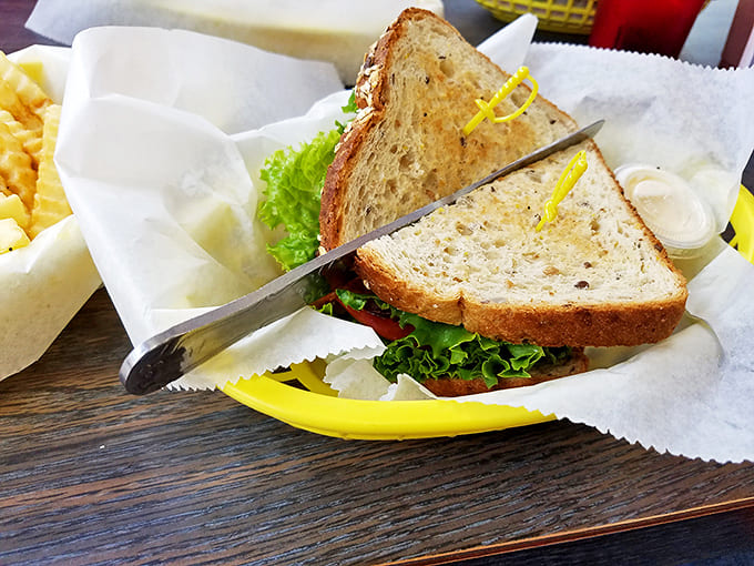 The BLT achieves sandwich perfection with the holy trinity of crispy bacon, garden-fresh lettuce, and juicy tomato on toasted bread.