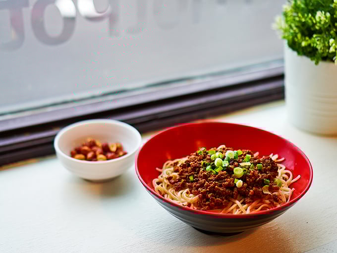 Dan Dan noodles that dance with flavor &ndash; the perfect marriage of spicy, savory, and nutty notes in one gloriously comforting bowl of Sichuan tradition.