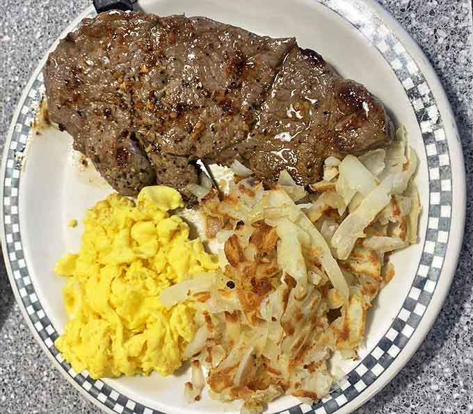Morning champions start their day with this hearty sirloin steak and eggs combo, served with golden hash browns that crunch just right.