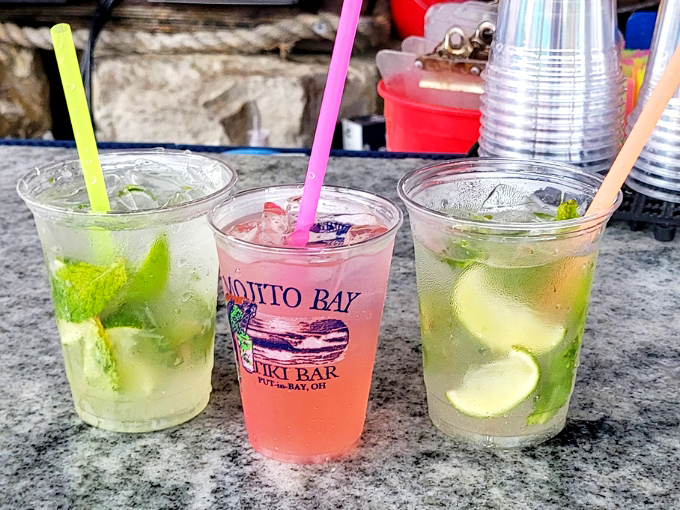 Three mojitos lined up like tropical soldiers, each ready to defend you against the reality that you're still in the Midwest.