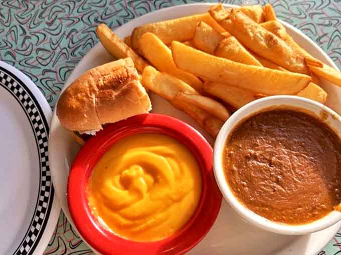 The dynamic duo of diner delights &ndash; a perfect slider alongside fries swimming in cheese sauce and hearty chili that warms the soul.