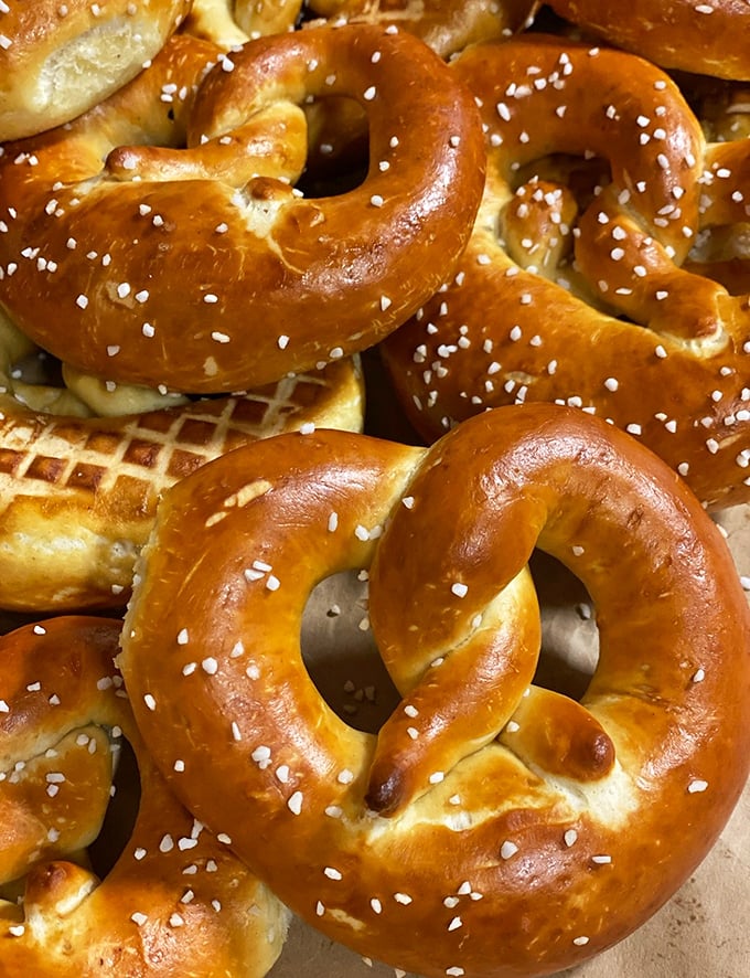 Soft Pretzels: A battalion of perfectly twisted pretzels stands ready for battle against hunger, each one sporting that signature mahogany sheen.