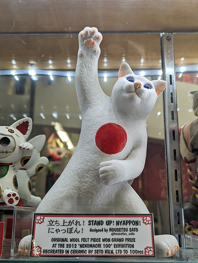 "Stand Up Nyappon!" &ndash; This award-winning ceramic cat with its dramatically elongated paw brings Japanese art innovation to Cincinnati.