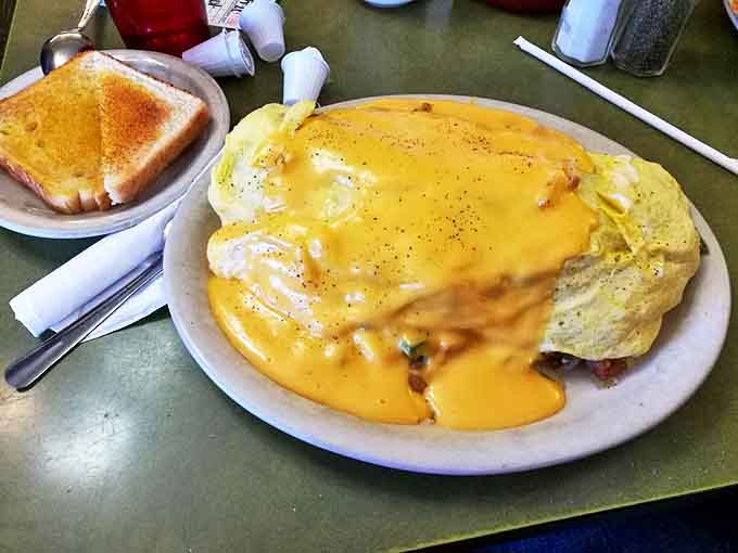 This isn't just an omelet &ndash; it's a cheese-draped miracle that makes you wonder if you should frame it or devour it. (Spoiler: always devour it.)