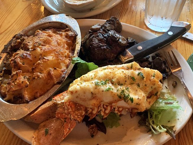 The ultimate land-meets-sea romance &ndash; a buttery lobster tail cozying up to a perfectly cooked steak with au gratin potatoes playing matchmaker.