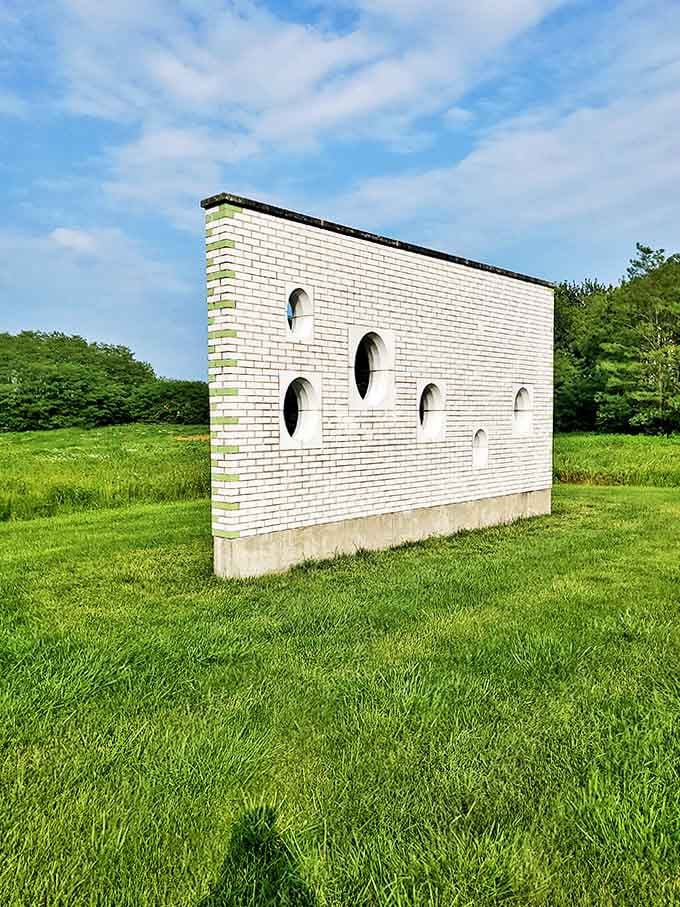 Not just another brick in the wall &ndash; these circular portals transform a simple barrier into a philosophical statement about what we choose to see.