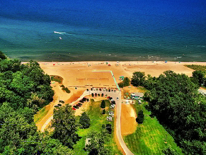 A bird's eye perspective reveals the beach's generous proportions and pristine shoreline, a hidden gem from above.