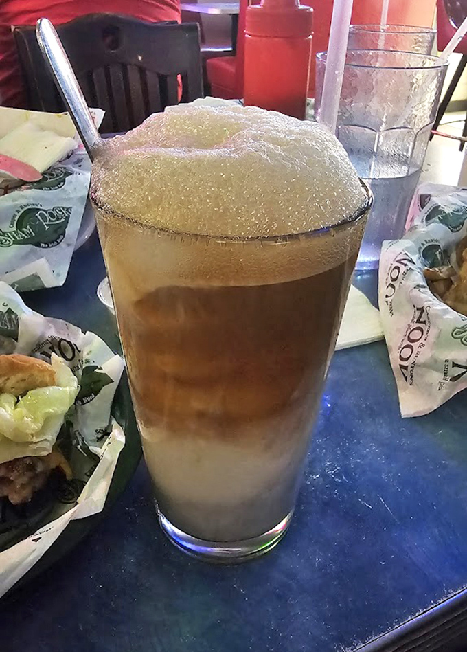 The famous Nook root beer float - a frosty mug of nostalgia that pairs perfectly with their legendary burgers.