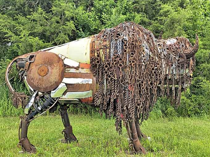 Majestic metal meets prairie power in this impressive bison sculpture, its flowing mane crafted entirely from repurposed chains and industrial scraps.