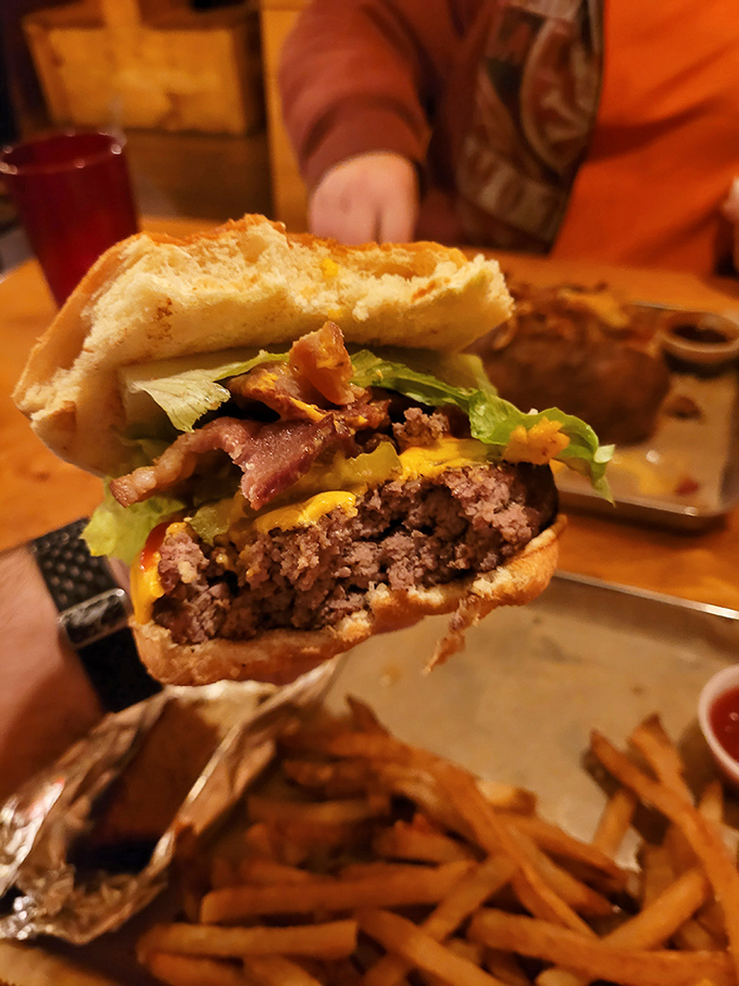 The burger cross-section reveals layers of flavor that would make a geologist jealous &ndash; each stratum more delicious than the last.