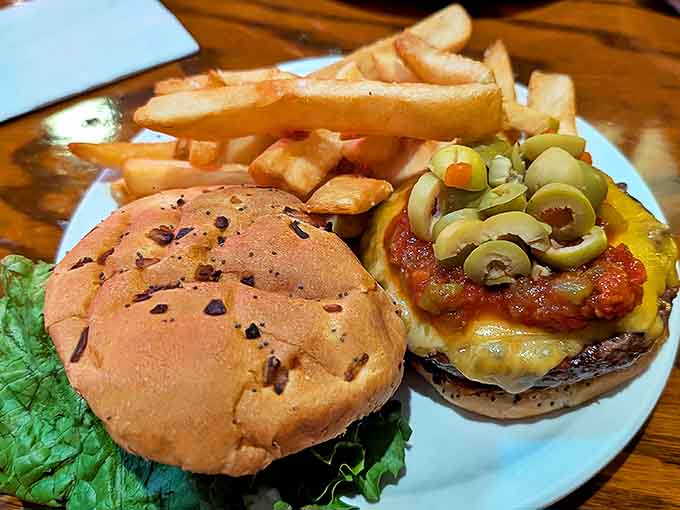 Melted cheese cascades over a perfectly grilled patty, creating that moment of anticipation that makes a great cheeseburger worth every calorie.