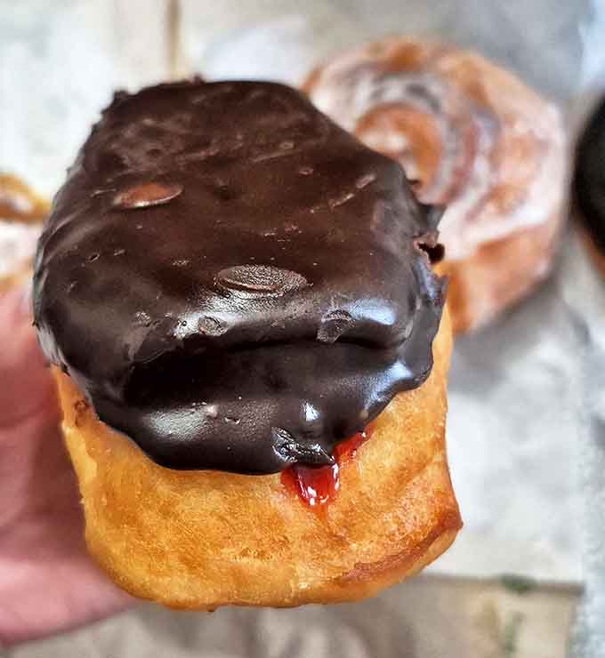 This chocolate-topped beauty with its surprise jelly center proves that sometimes the best things in life come with a little unexpected squirt.