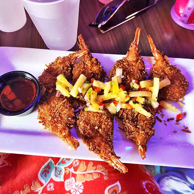 Coconut shrimp that could make a mermaid swim upstream &ndash; crispy, golden treasures served with a pineapple sauce worth diving for.