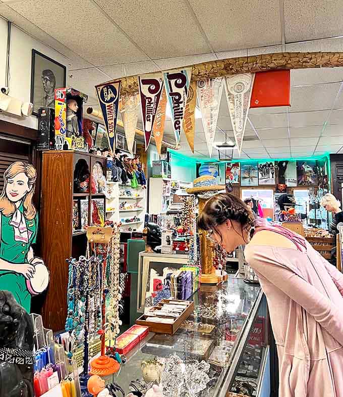 Treasure hunters browse display cases filled with collectibles, each item a potential connection to someone else's cherished memories.