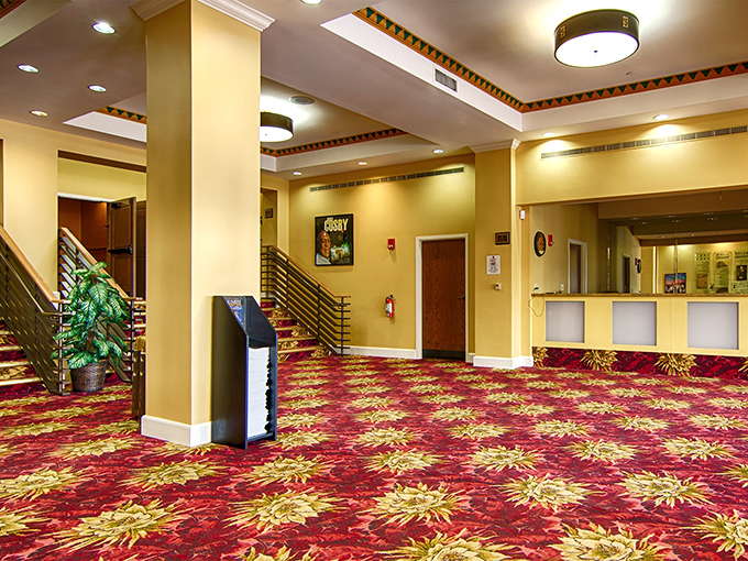 Rich carpeting and warm tones welcome visitors to the lobby, where intermission conversations become part of the evening's entertainment.
