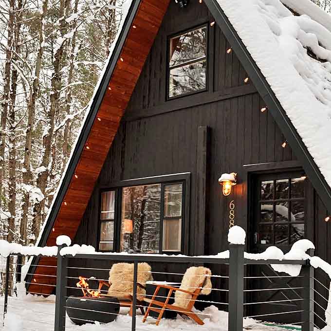 This snow-dusted A-frame looks like it jumped straight out of a winter fairy tale &ndash; cozy incarnate with a side of architectural charm.