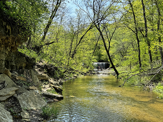 Another perspective of the falls reveals how the water catches light like nature's own jewelry display, glinting with invitation.