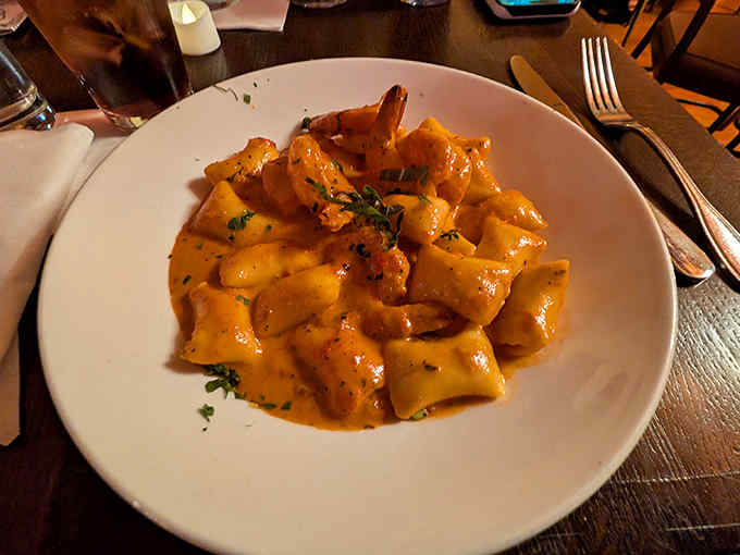 Pillowy gnocchi swimming in vodka sauce – the pasta equivalent of sinking into a velvet couch after a long day of bootlegging.