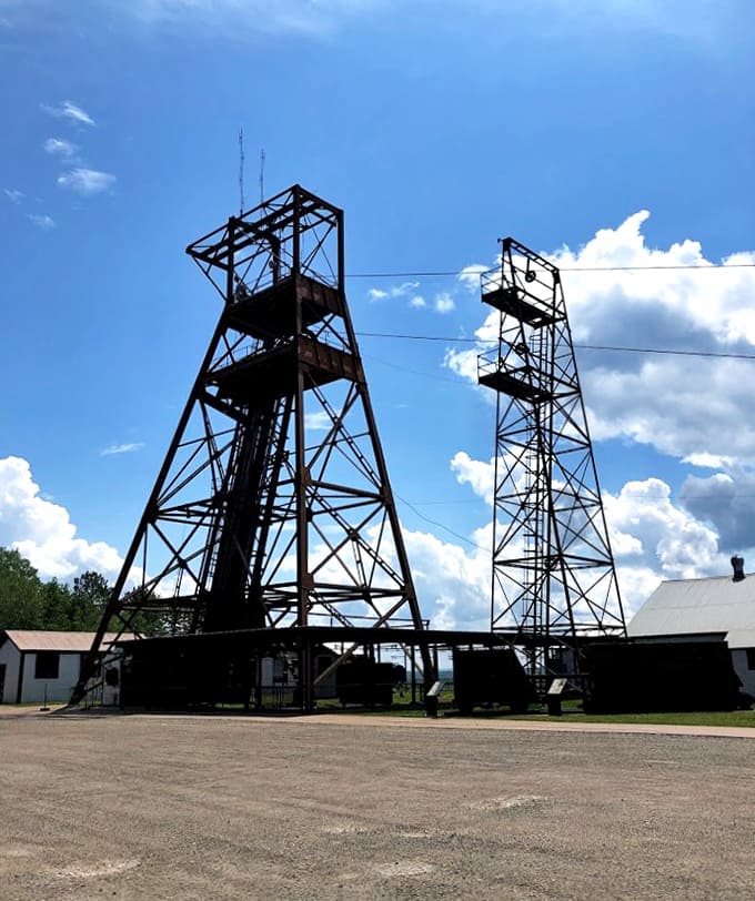 Twin sentinels: These massive headframes once lowered thousands of miners into the earth's depths, now standing as monuments to industrial ingenuity.