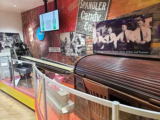Journey back in time with this authentic candy production equipment display, showcasing the vintage machinery that helped build Spangler's sweet empire.