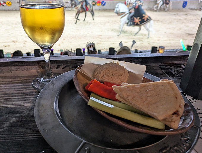 This hummus plate looks suspiciously modern for a medieval feast, but nobody's complaining when there's flatbread involved and jousting to watch.