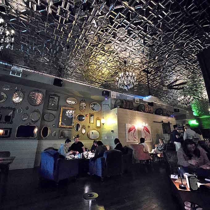 Conversation corners await &ndash; Plush velvet seating in jewel tones creates intimate spaces where whispered secrets and hearty laughter blend with the ambient jazz.