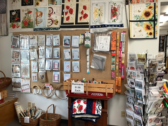 The classroom space transforms from fabric showroom to creative workshop, where quilting friendships are stitched as permanently as well-made seams.