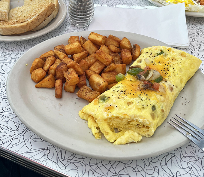 This isn't just an omelet &ndash; it's a fluffy egg blanket wrapped around fillings that make vegetables before noon seem like genius.