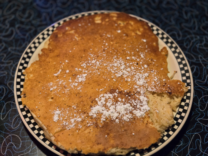 Golden pancakes dusted with powdered sugar &ndash; so fluffy they practically float off the plate and into breakfast heaven.