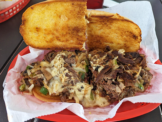 This Philly cheesesteak isn't trying to win awards &ndash; it's too busy making your taste buds dance with perfectly melted cheese and tender beef on toasted bread.