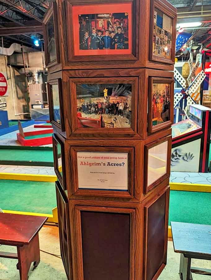 Past visitors smile down from the walls, proof that thousands have embraced the delightful absurdity of basement funeral home golf.