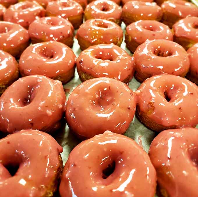 That glossy raspberry glaze catches the light like edible jewelry, and the flavor delivers on every promise that gorgeous color makes to your eager taste buds.