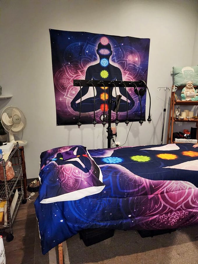 This massage room features chakra-themed decor that would make even skeptics curious about energy healing and holistic wellness practices.