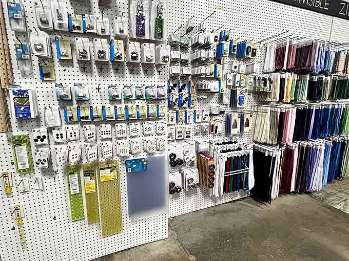 The notions wall &ndash; where buttons, zippers, and tools await like the supporting actors in your fabric's starring role.