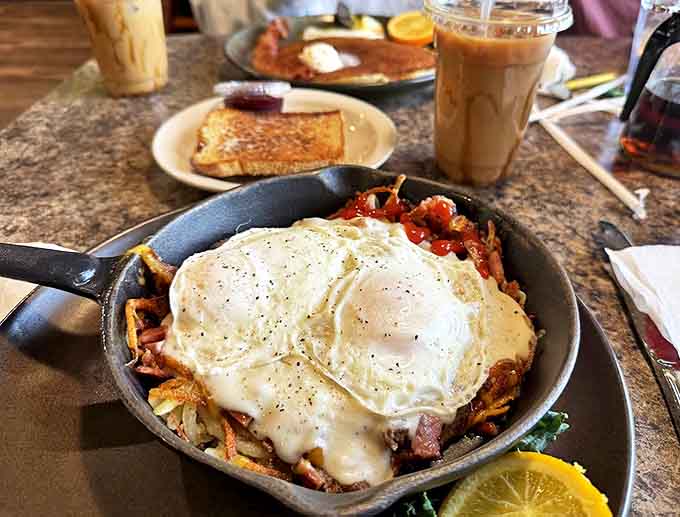 Sizzling perfection in cast iron&mdash;eggs nestled atop a mountain of savory ingredients create a breakfast worth crossing county lines for.