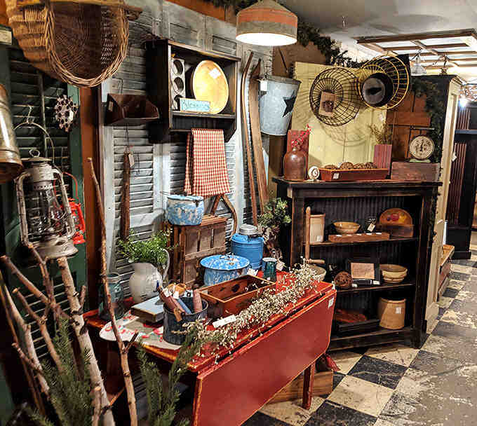 Rustic wooden treasures line this corner, from weathered farm tools to handcrafted furniture pieces that showcase craftsmanship rarely seen in modern manufacturing.