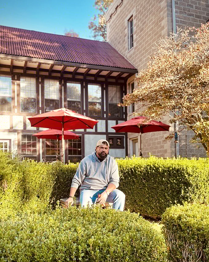 The carefully maintained gardens provide peaceful spots for contemplation, with manicured hedges framing quiet moments of reflection.