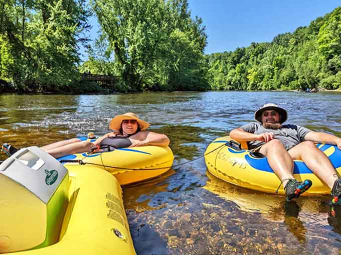 "No office has a view this good!" Two happy tubers demonstrate the art of perfect relaxation on Michigan's White River.