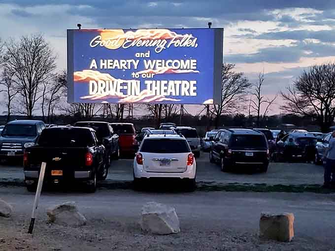 Cars line up in neat rows, each vehicle a private theater where families and couples create their own perfect movie-watching environment.
