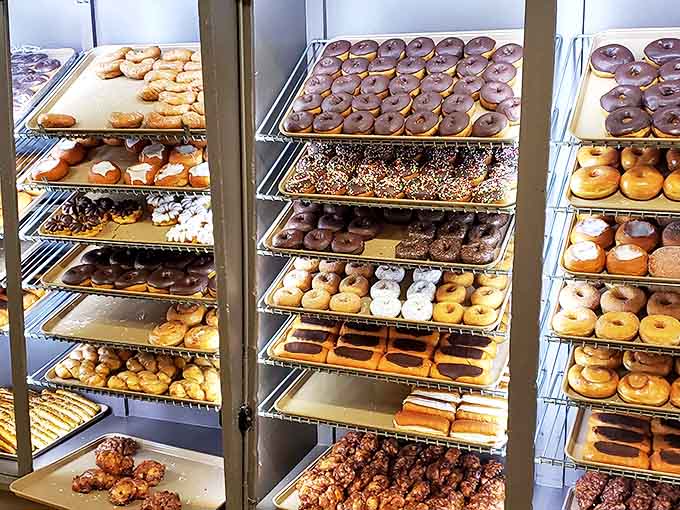 The donut display isn't just a case &ndash; it's a museum of circular joy where each shelf tells a different story of fried dough perfection.