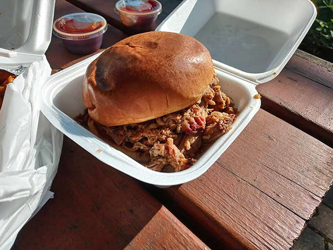 Brisket piled so high on a bun it's practically an architectural achievement in sandwich form.