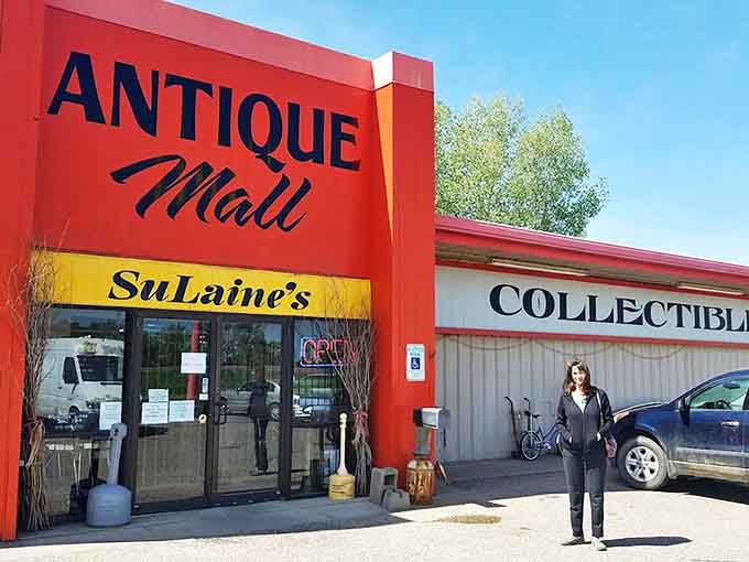 Sulaine's Antique Mall announces itself with bold red signage that stands out against the night sky, beckoning late-day treasure hunters inside.