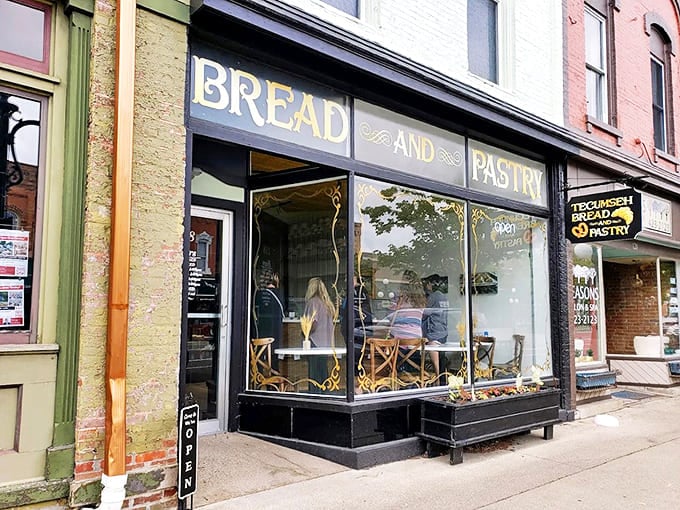 Tecumseh Bread & Pastry's storefront features large windows that offer a peek at the artisanal baking happening inside.