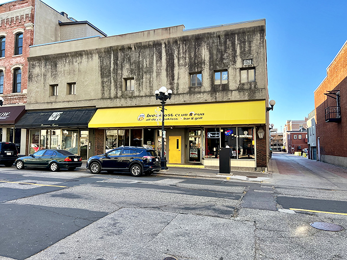80s nostalgia alert! The Breakfast Club & Pub's bright yellow awning stands out on La Crosse's historic Main Street.