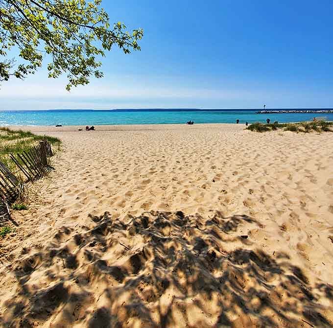 Van's Beach welcomes visitors with soft sands and azure waters, a perfect slice of paradise nestled beside Leland's historic Fishtown.