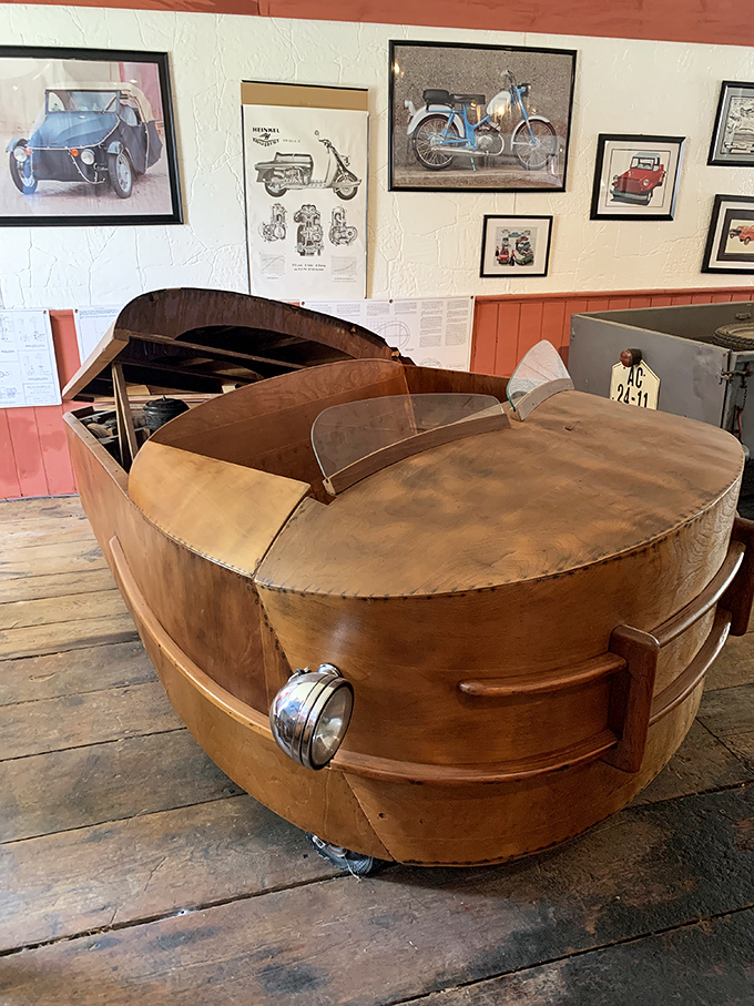 This wooden-bodied microcar looks like it was designed by someone who'd heard about automobiles but decided to wing it anyway.