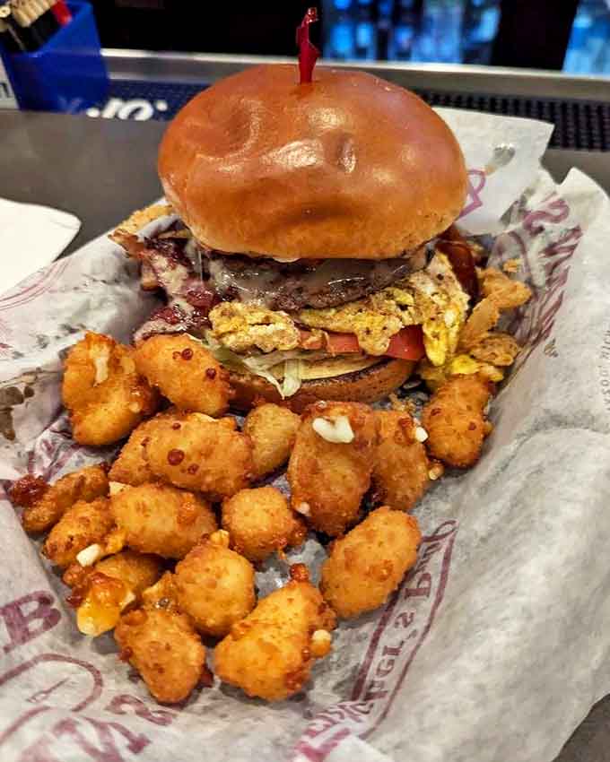 A towering achievement in burger architecture that makes you wonder if you should eat it or apply for a building permit.